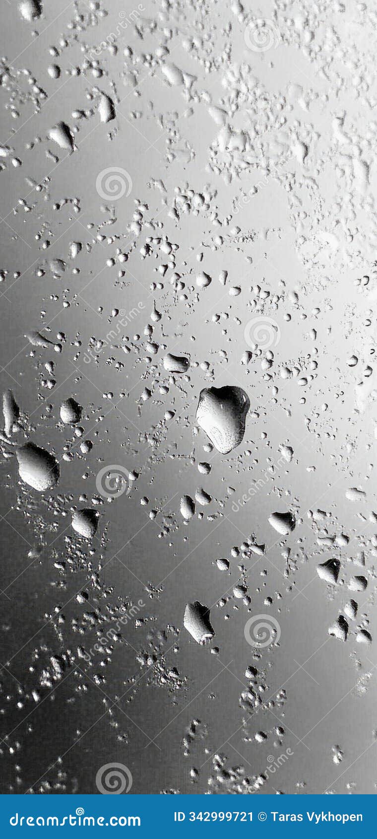 Close-up View of Raindrops on a Window Creating a Reflective and Moody ...