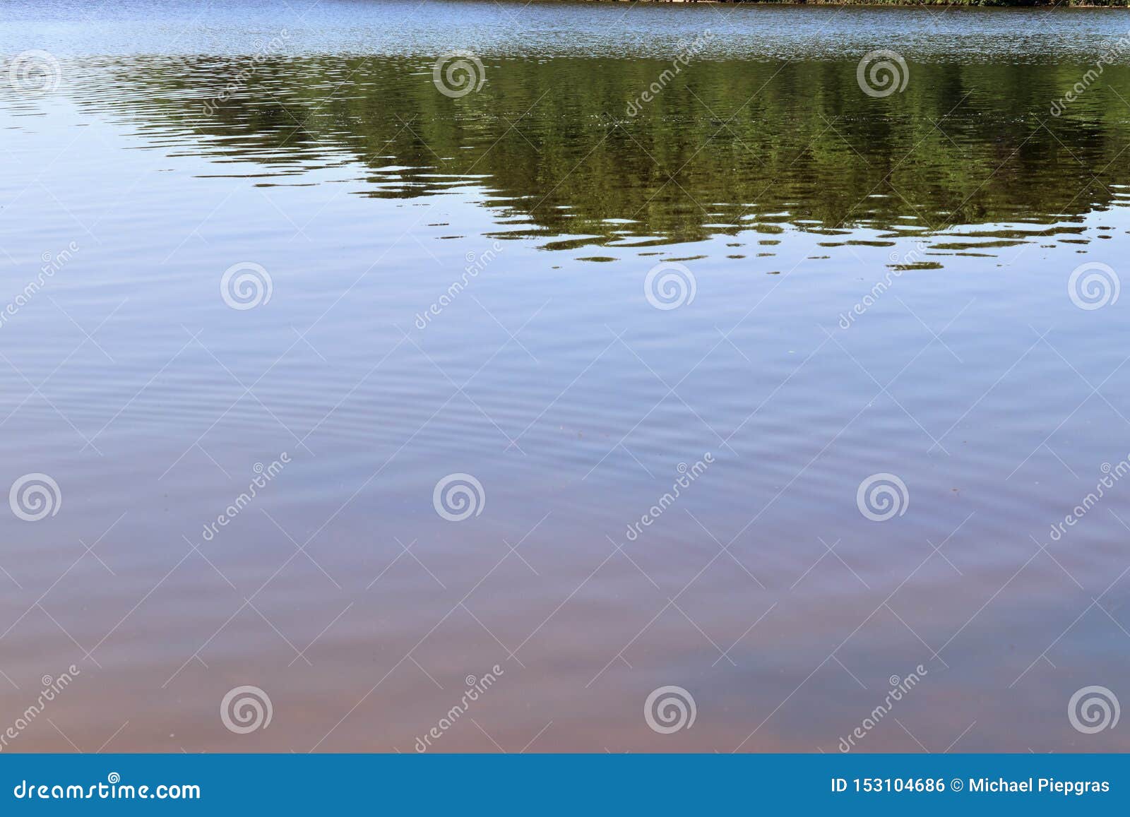 Close Up View on a Reflective Water Surface with Waves and Ripples in ...