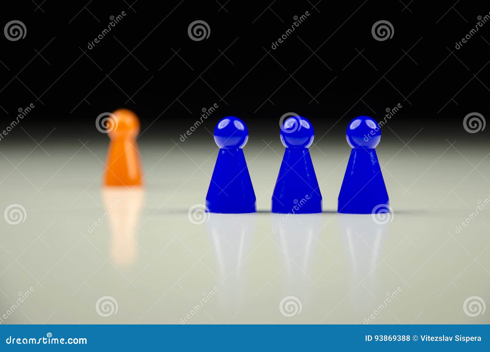 Close-up View of a Row of Blue Figures with One Red Figure at the Back ...