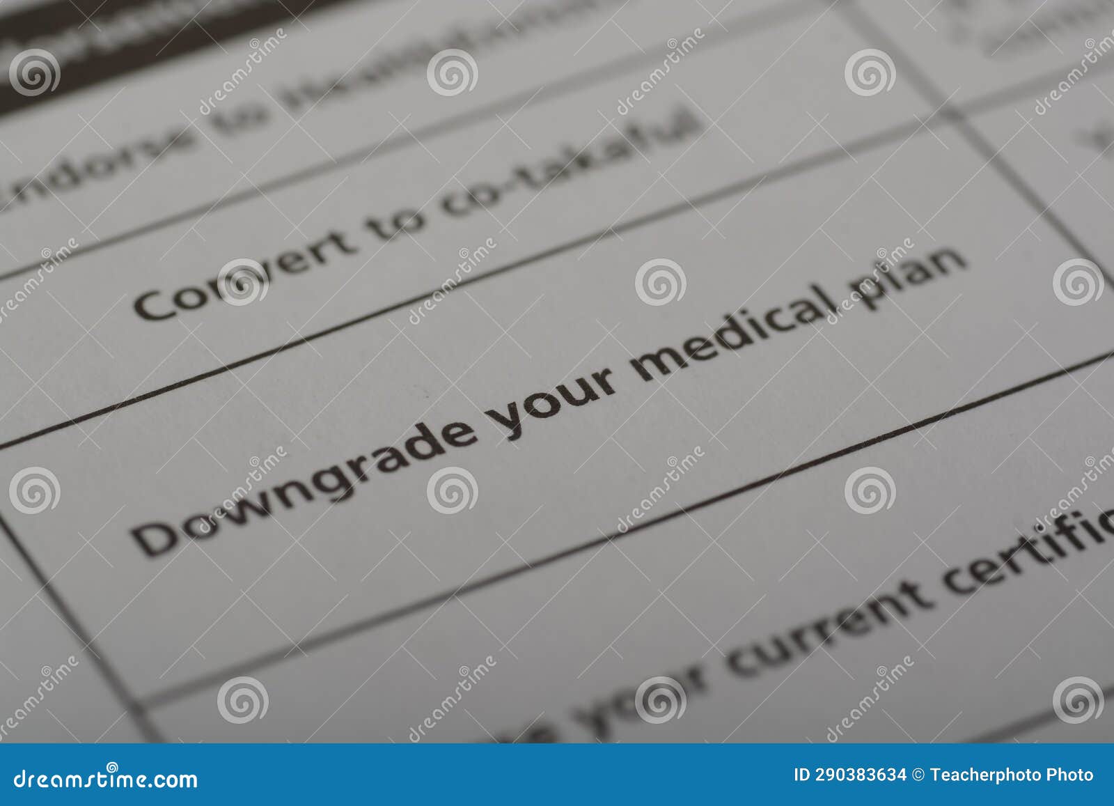 Close Up View of the Sentence DOWNGRADE YOUR MEDICAL PLAN Stock Photo ...