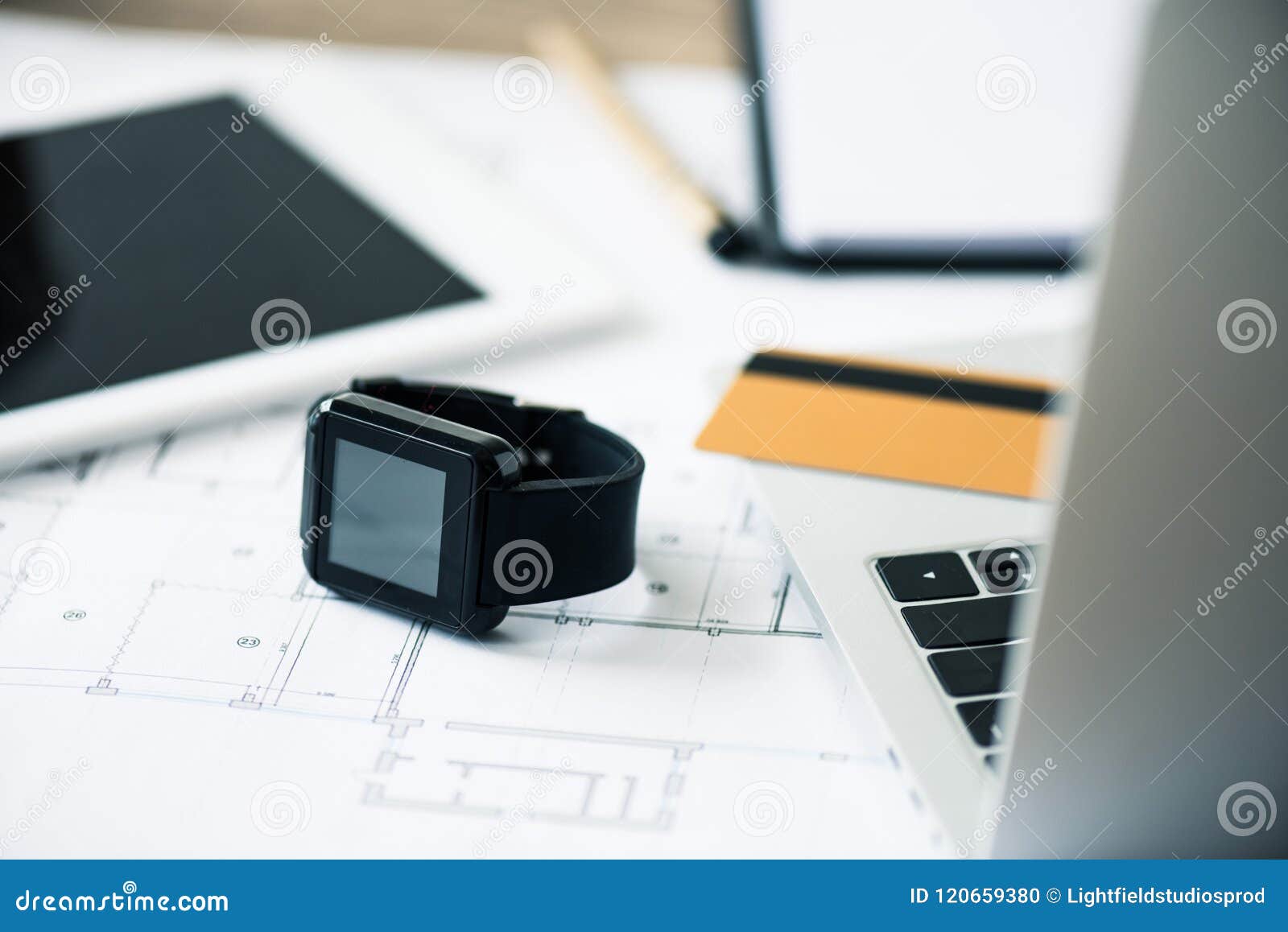Close-up View of Smartwatch, Laptop, Digital Tablet and Blueprint Stock ...