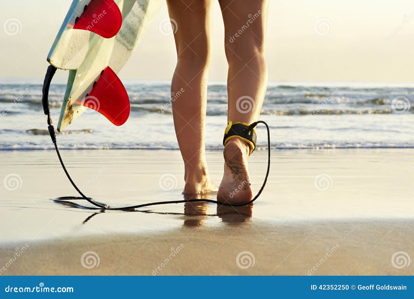 Close Up View of Surfer Walking Along Beach Towards Surf Stock Photo ...