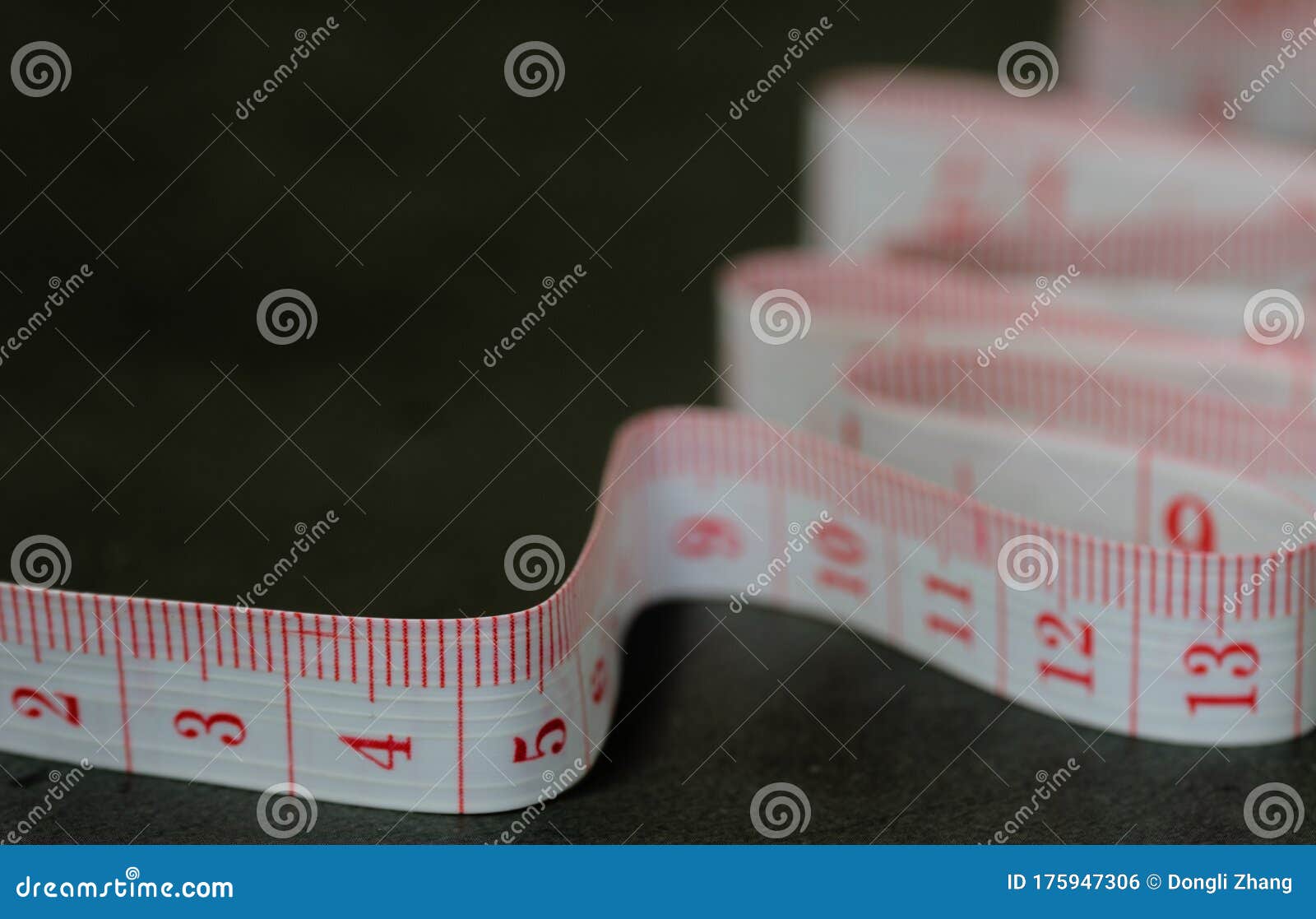 Close Up View of Tailor Measuring Tape on Black Background Stock Photo ...
