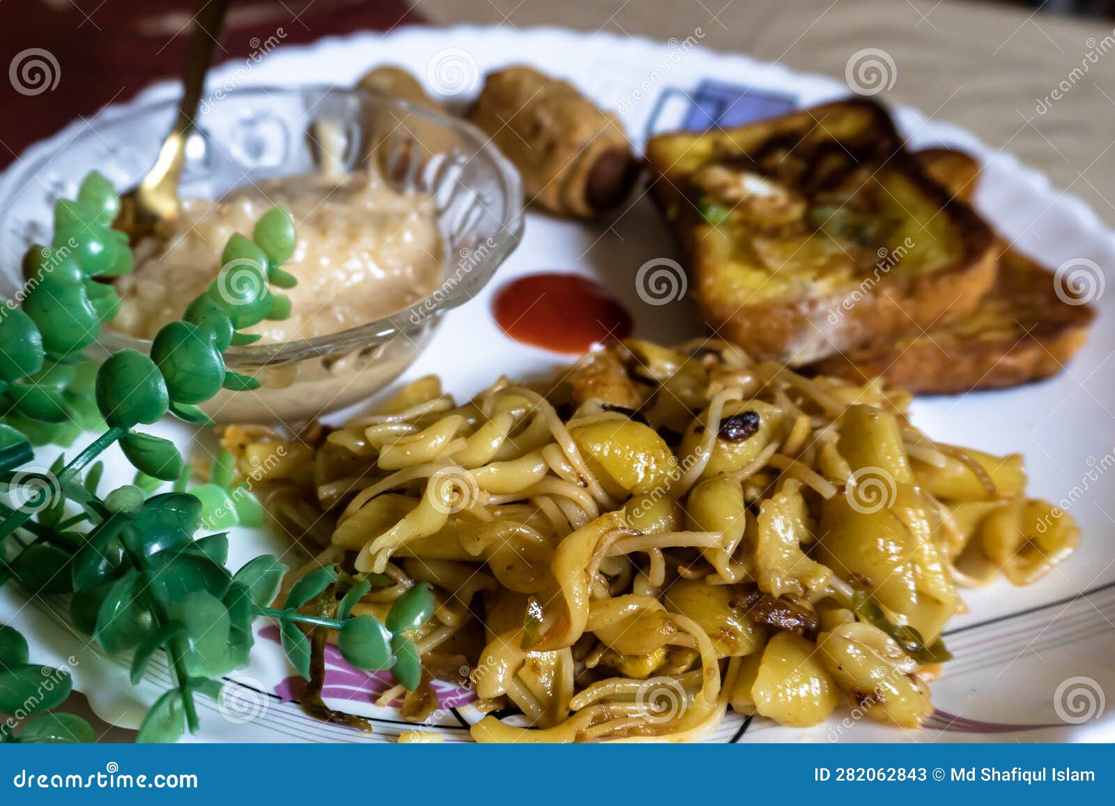 Close-up View of Tasty Pasta with Blurred Fried Bread, Vegetable Roll ...