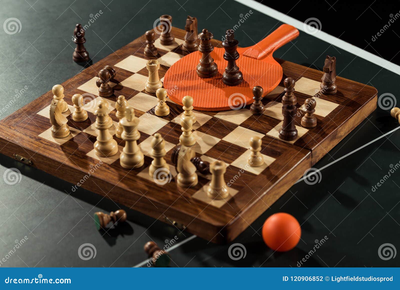 Close Up View of Tennis Racket, Ball and Chess Board with Figures Stock ...