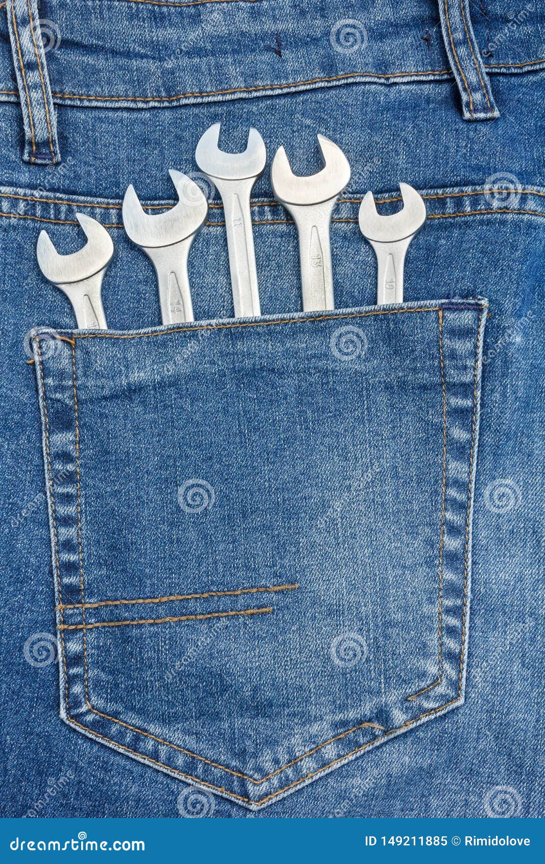 Close Up View To Working Tools Sticking Out from a Blue Jeans Pocket ...