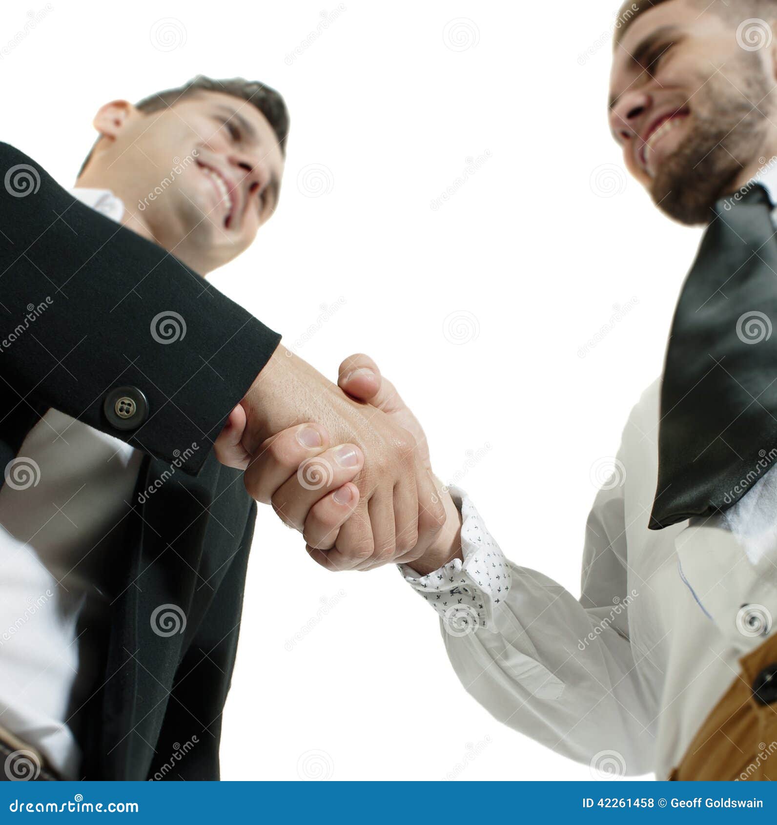Close Up View of Two Businessmen Exchanging a Hand Shake of Agreement ...