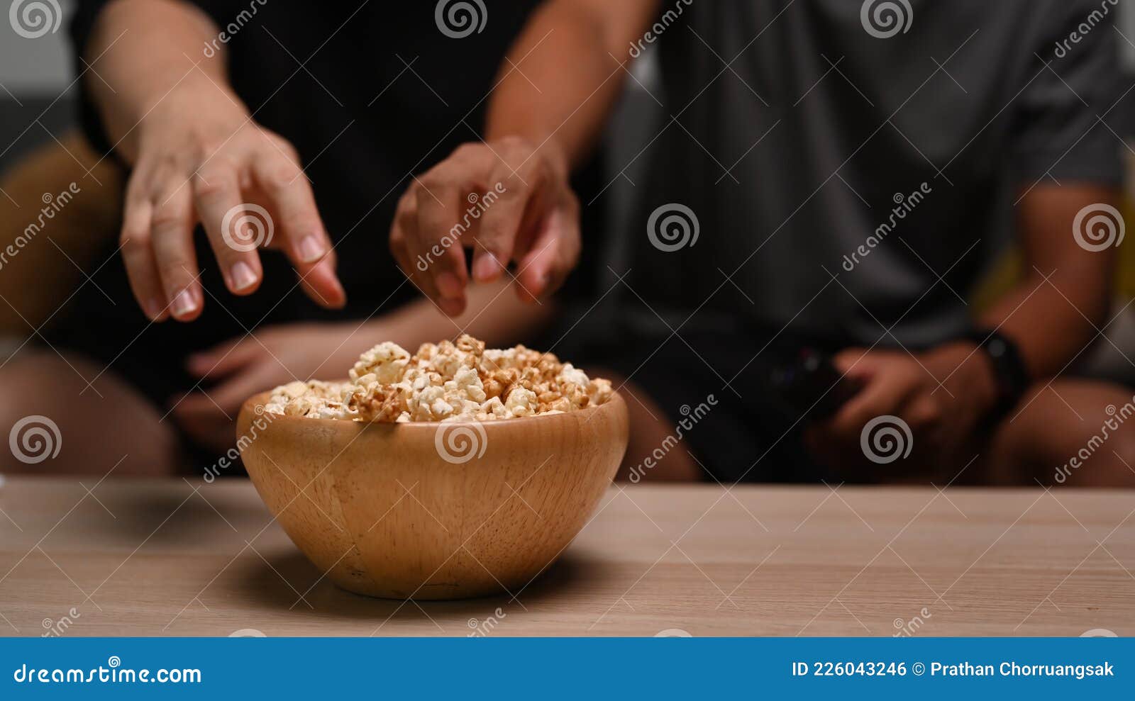 Two Men Sitting on Couch and Eating Popcorn. Stock Photo - Image of ...