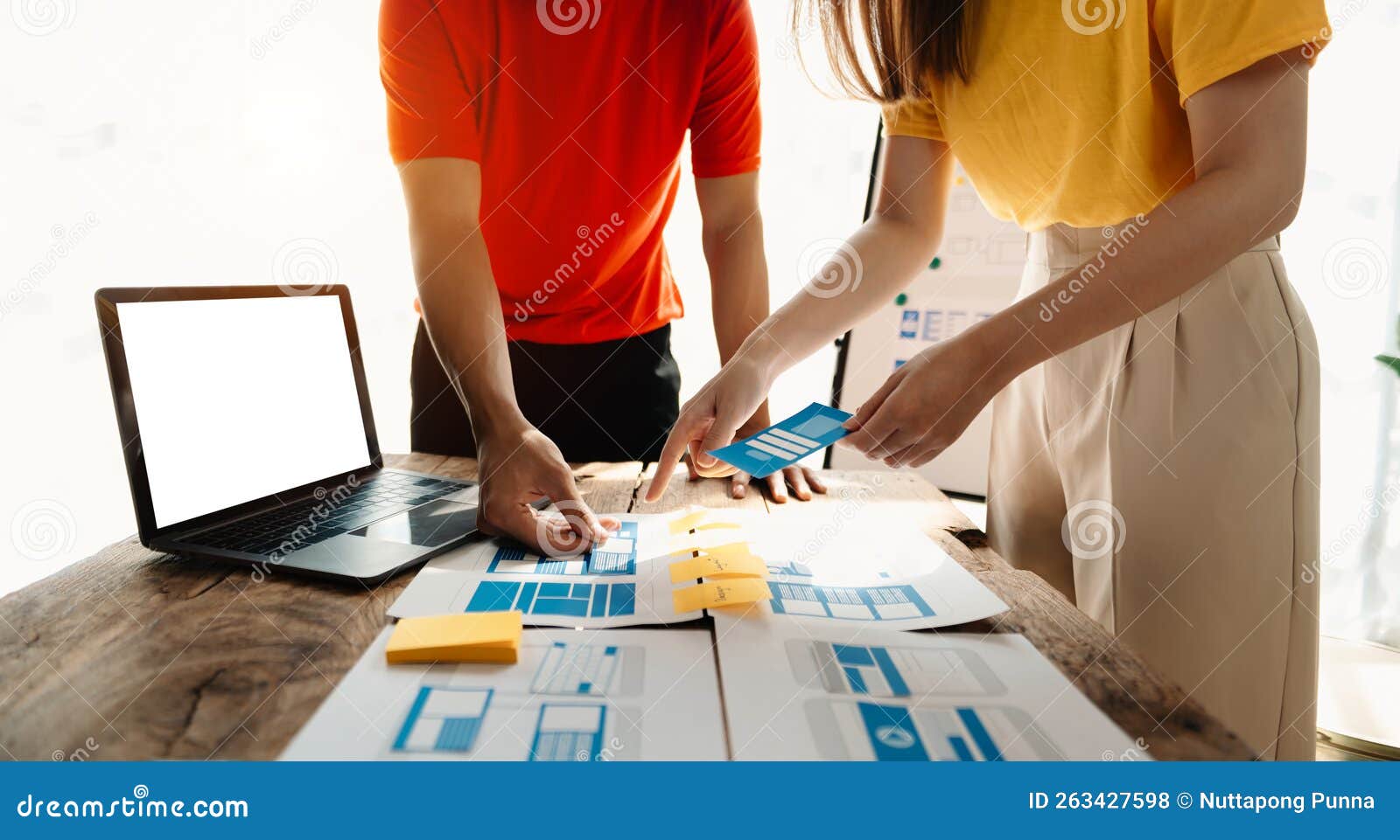 Ui Developer Team Brainstorming On Their Project With Laptop