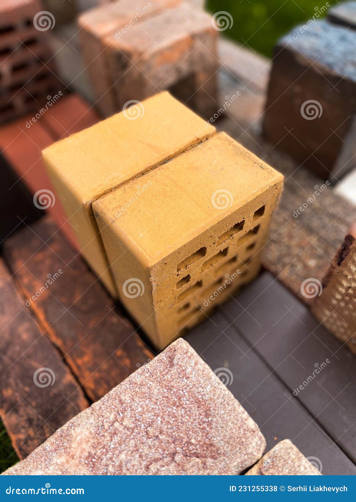 Different Types of Bricks Stacked Beautifully on Green Grass Stock ...