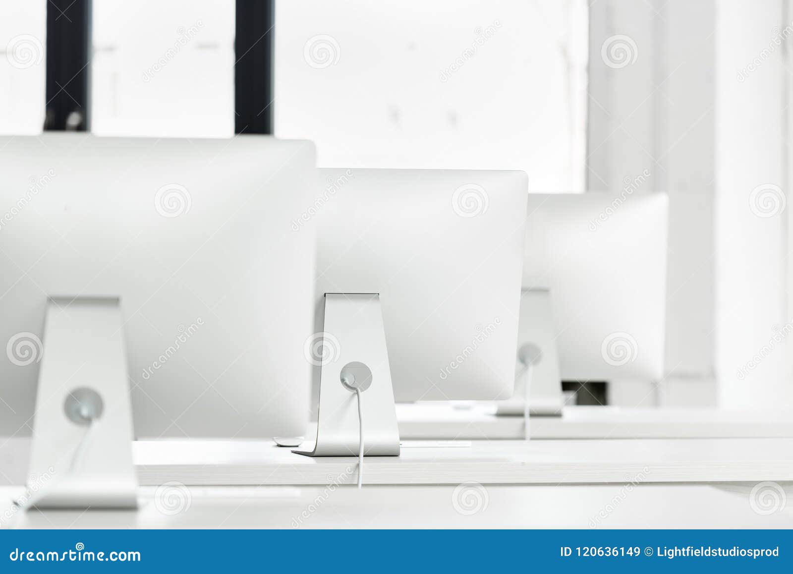 Close Up View of White Computer Monitors Standing on Tables Stock Image ...