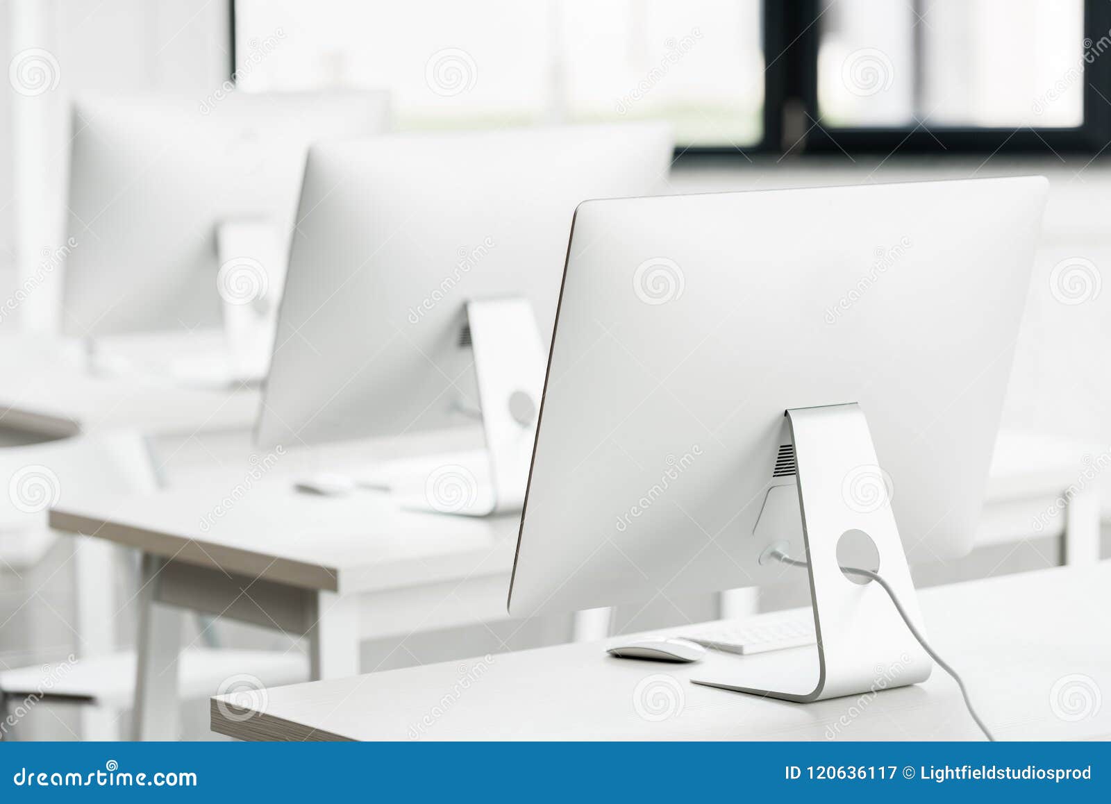 Close Up View of White Computer Monitors Standing on Tables Stock Image ...