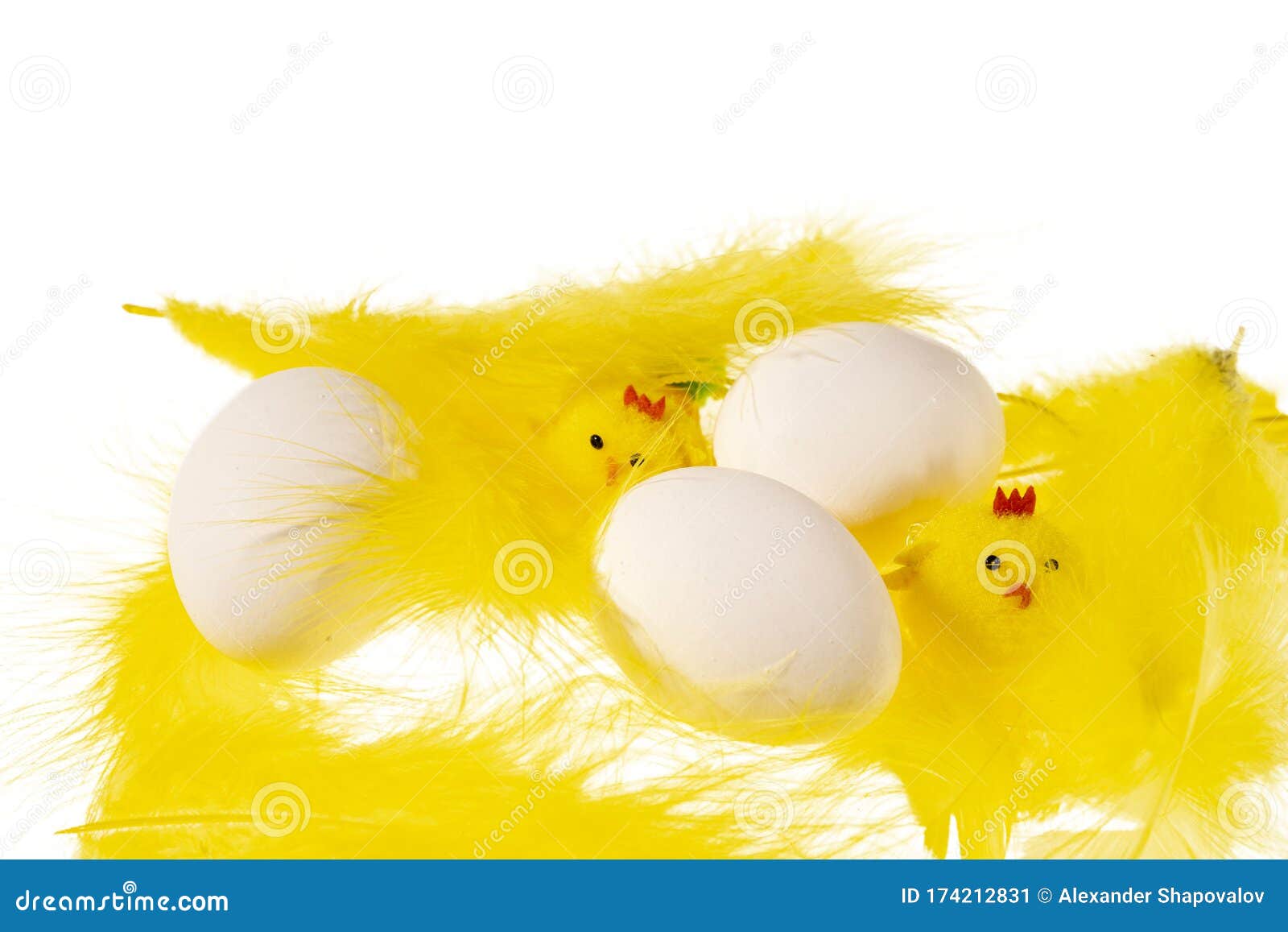 Close Up View of White Eggs and Yellow Feathers and Chick Figures ...