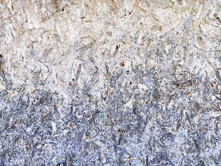 A Close-up View of a White and Gray Oriented Strand Board. Background ...
