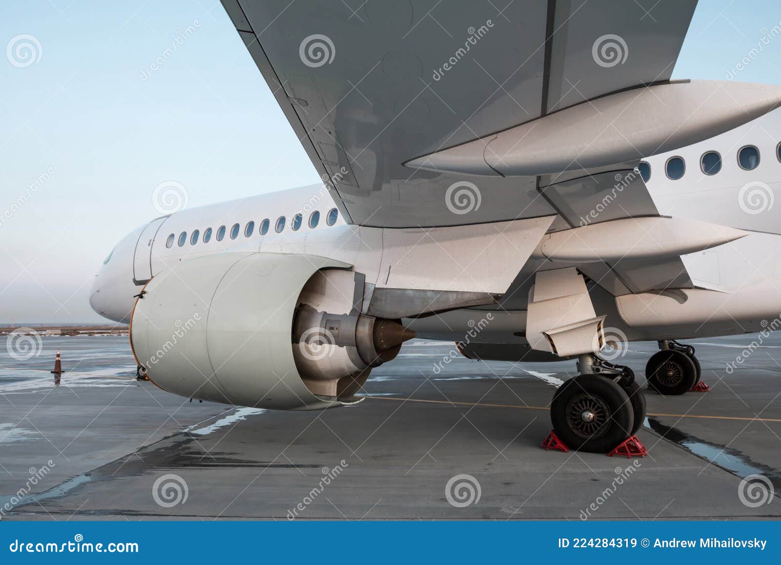 Close-up View of a White Passenger Jet Plane from Under the Wing Stock ...
