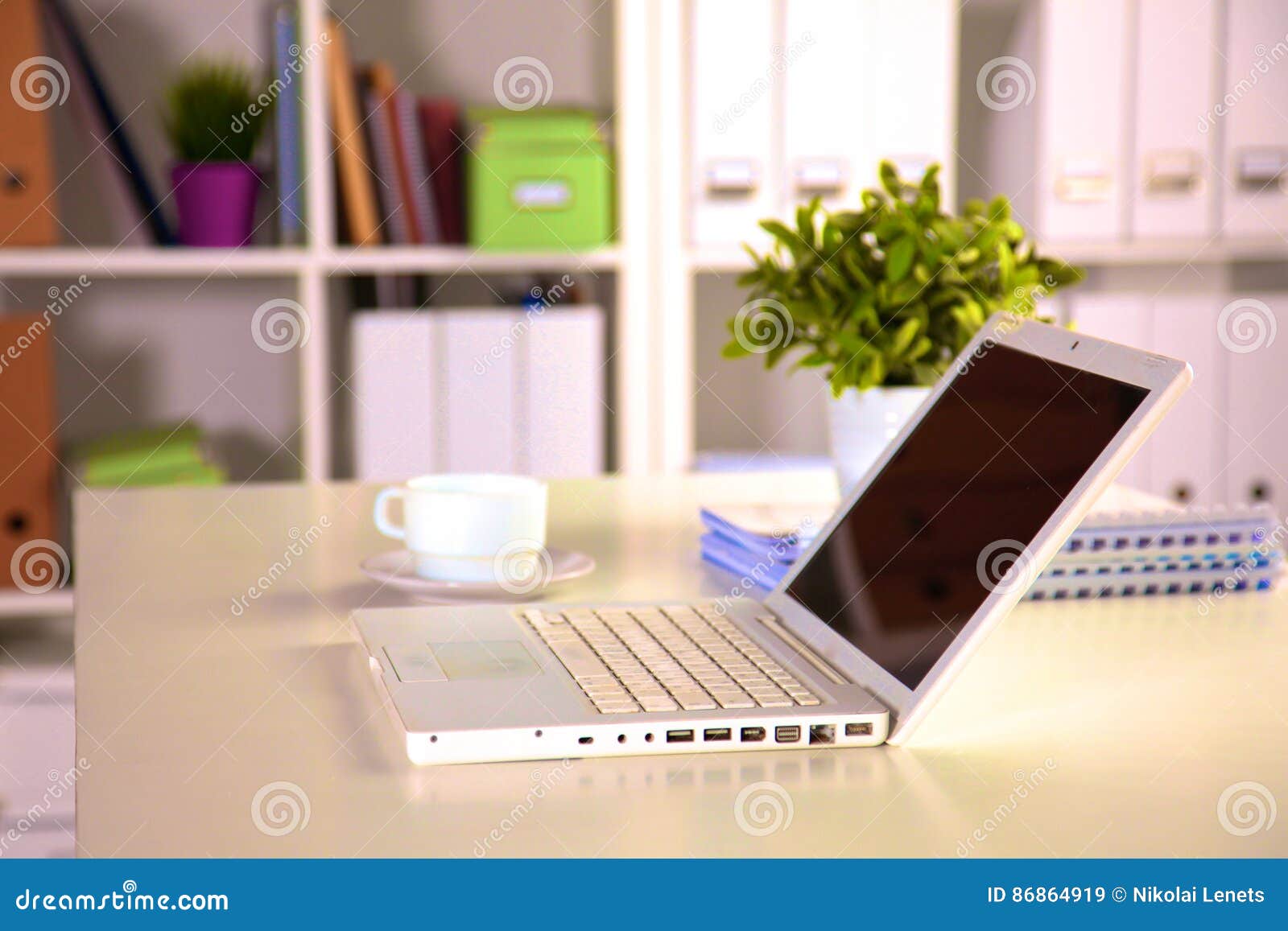 Close Up View of a Work Desk Interior with a Laptop Computer, a Cup of ...
