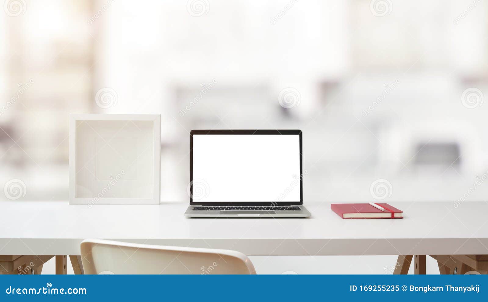 Close Up View of Workspace with Open Blank Screen Laptop, Frame and ...