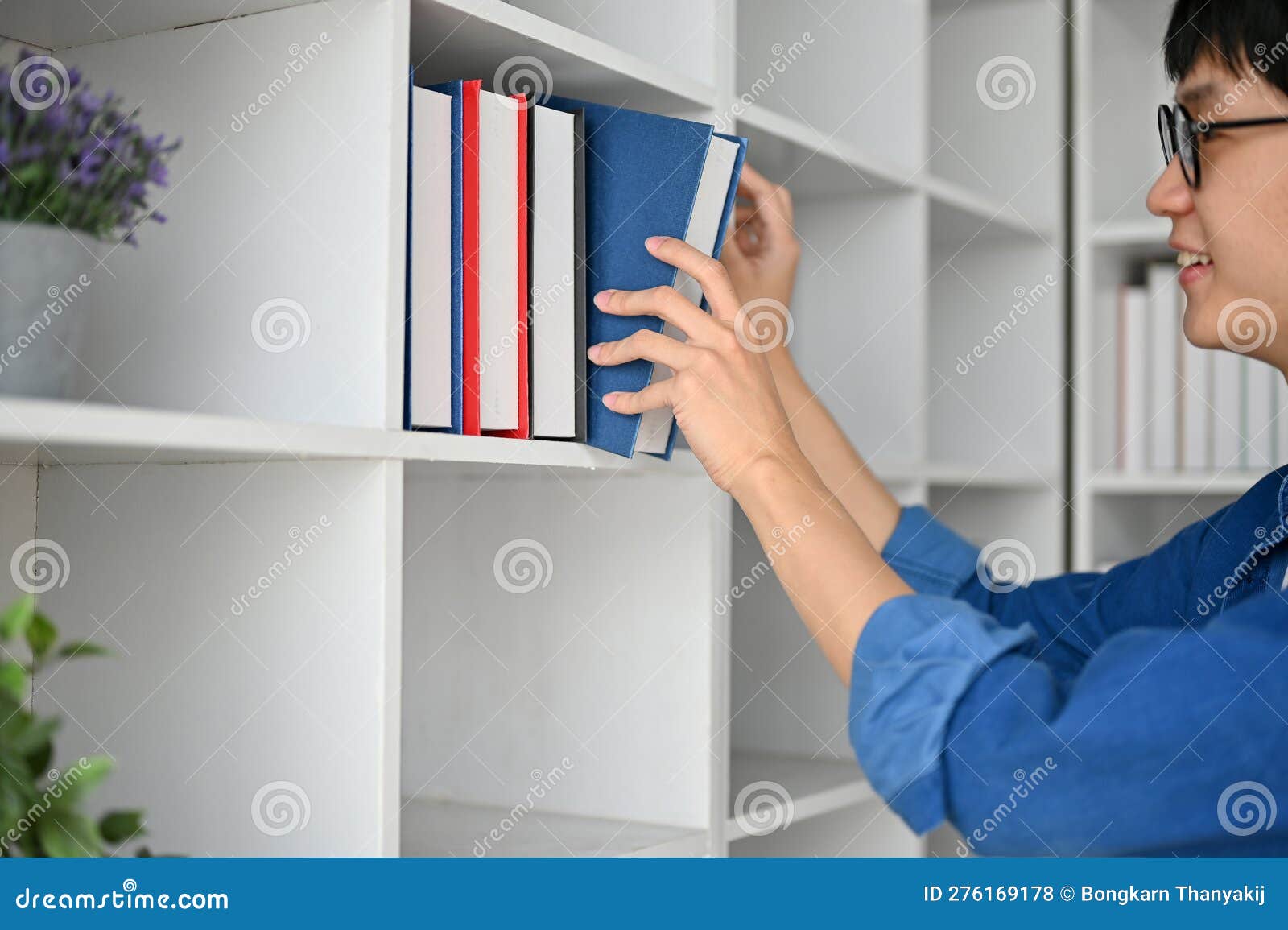 Close Up View of Young College Student Pick Up a Book for Study Stock ...