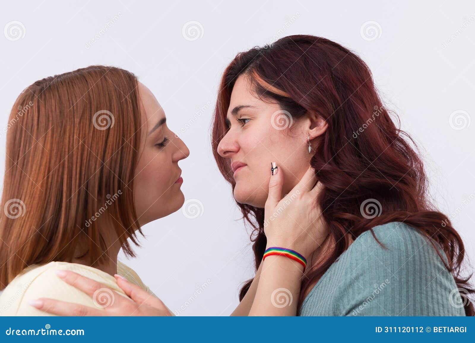 Close Up View Of Young Redhead Lesbian Couple Looking Each Other In The