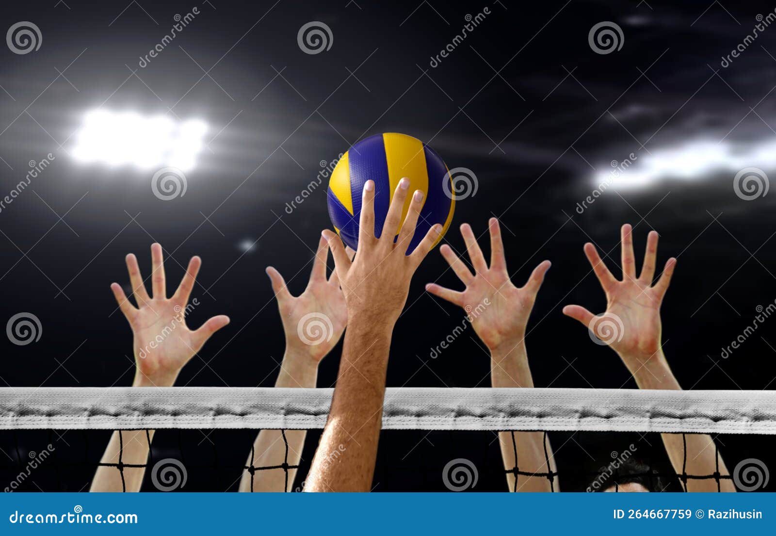 Close Up of Volleyball Spiking and Hand Blocking Over the Net Under ...