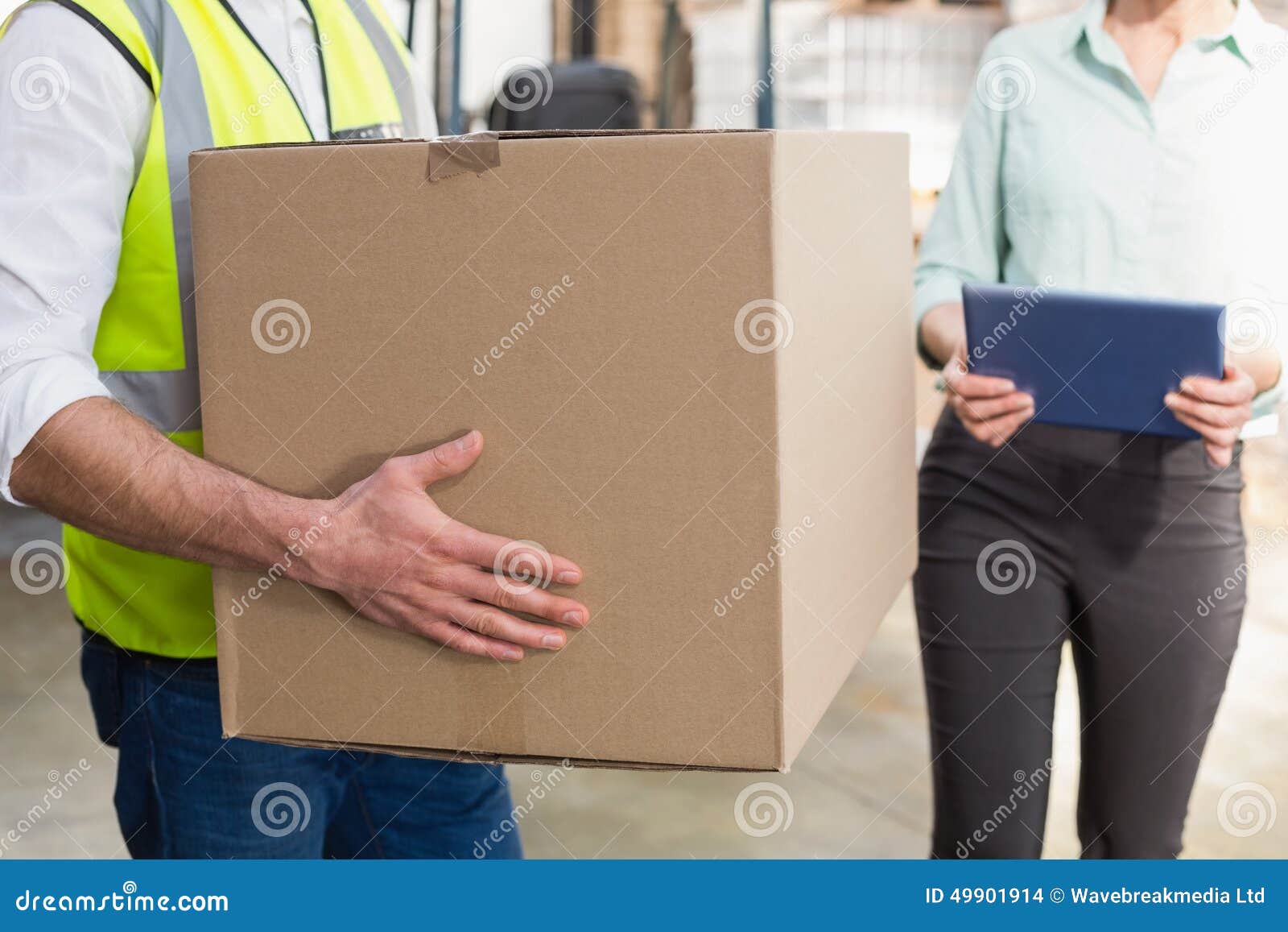 Close Up of a Warehouse Worker Carrying Box Stock Photo - Image of ...