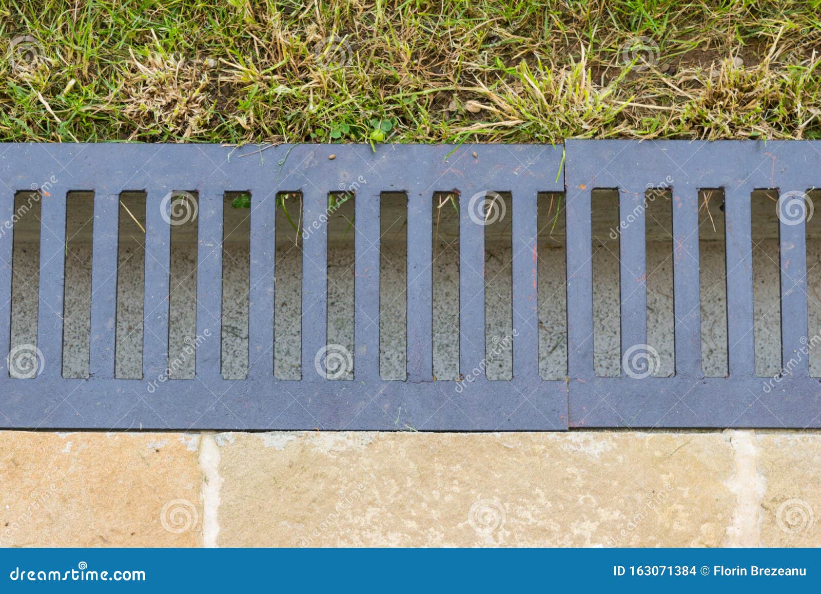Close-up of Water Drain Gutter that Separates the Lawn from the Paved ...