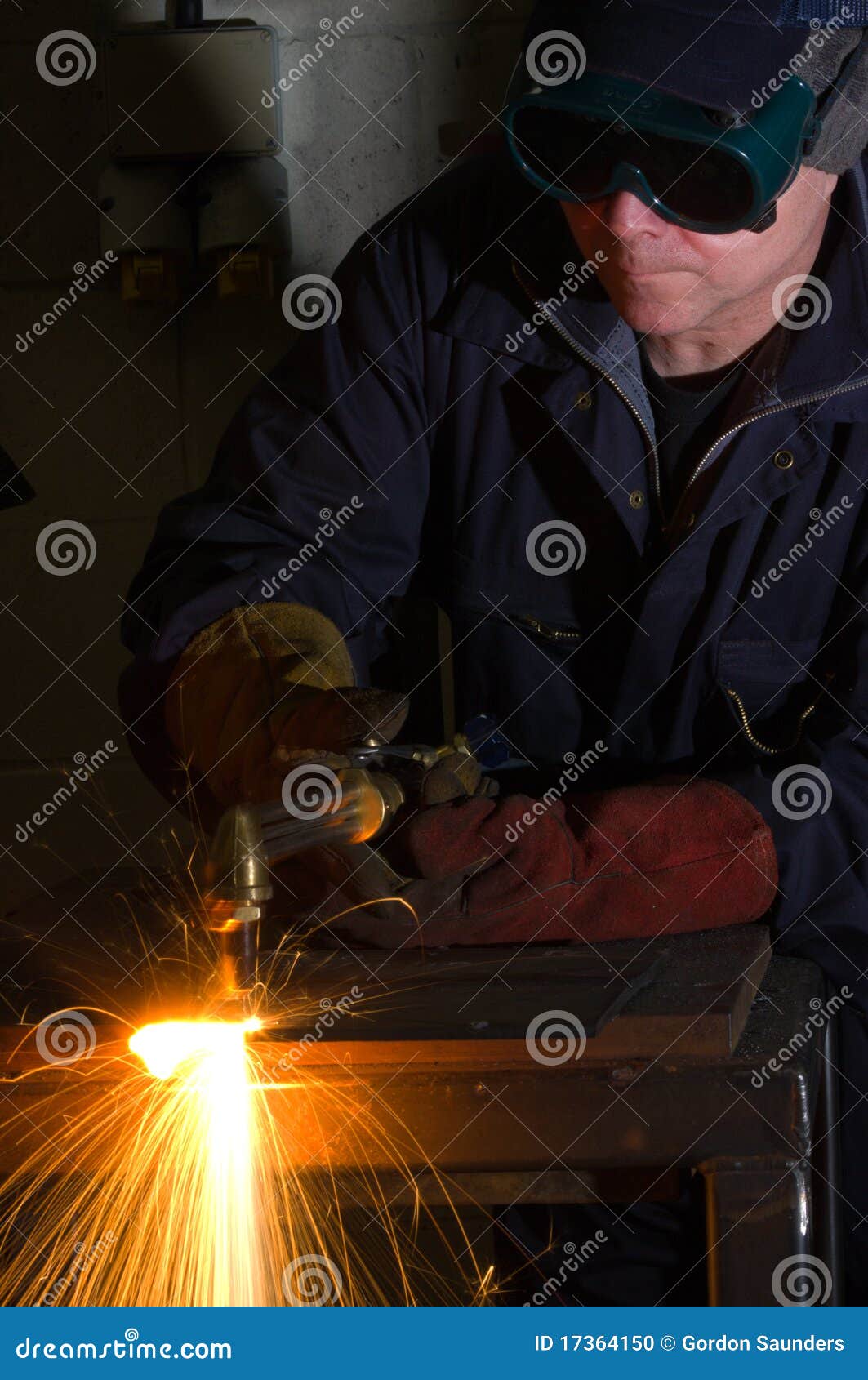 Close Up Of Welder With Orange Sparks Stock Photo - Image of black ...