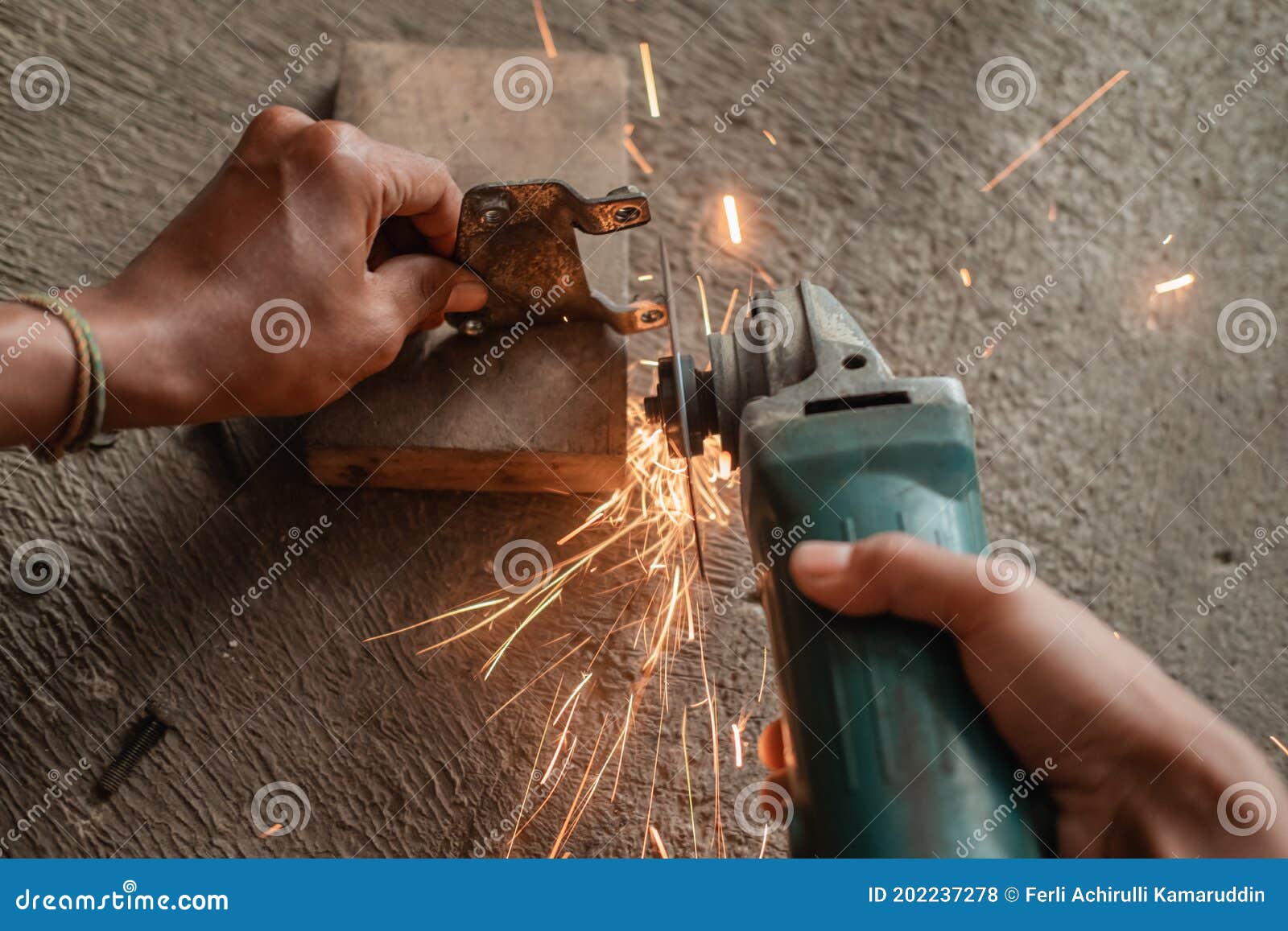 Close Up of Welder`s Hand Using a Grinder To Smooth the Surface of the ...