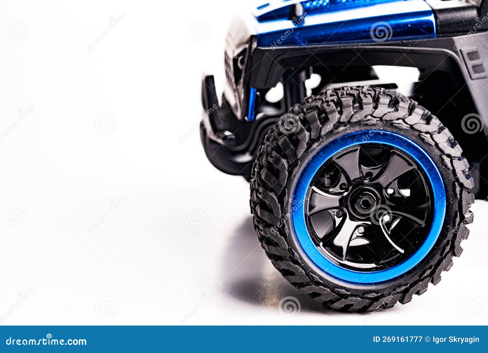 Close-up of a Wheel with an Off-road Tread on a White Background. Space ...