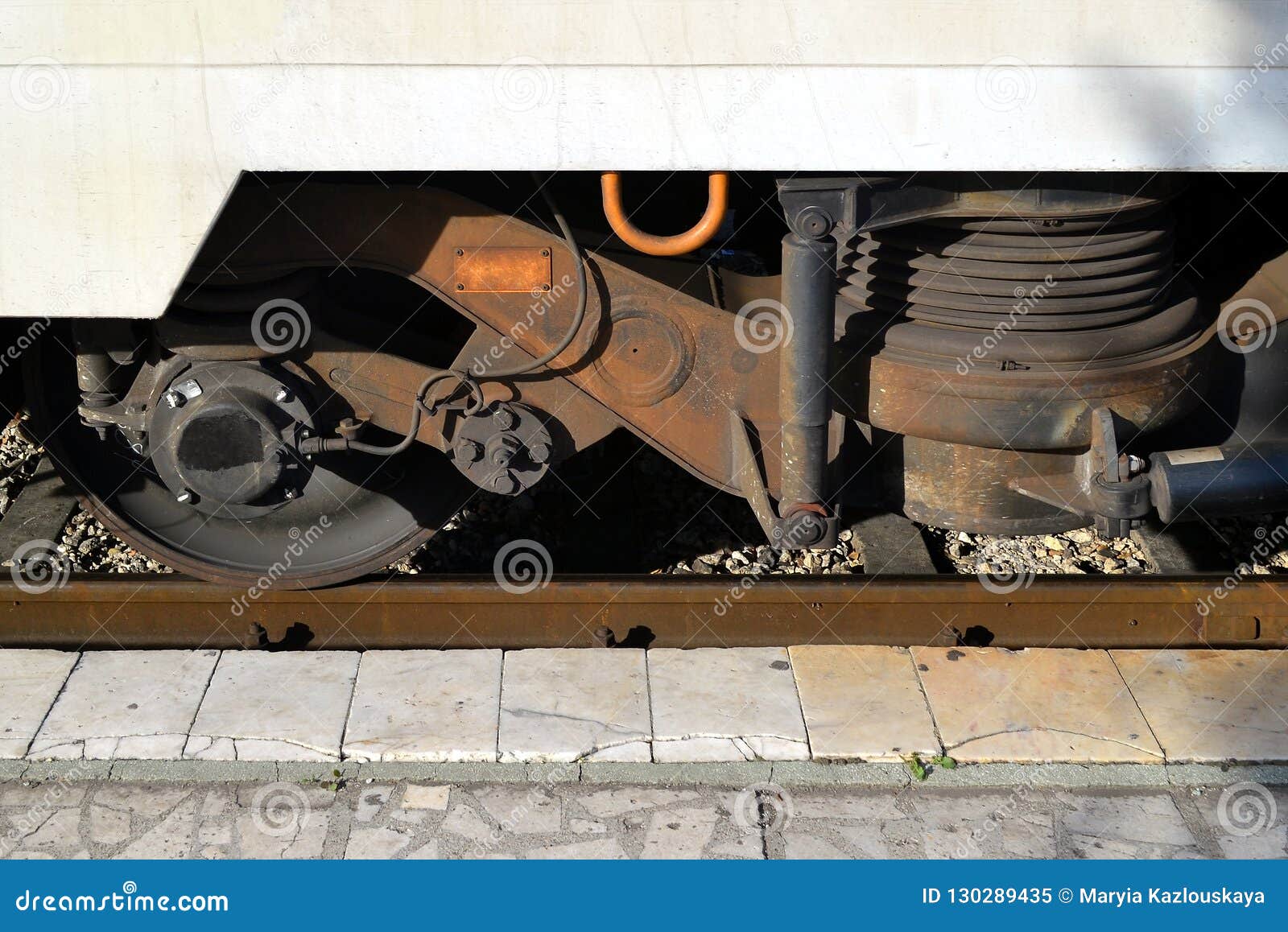 Close Up of Wheel and Springs of a Passenger Car on a Railway Platform ...