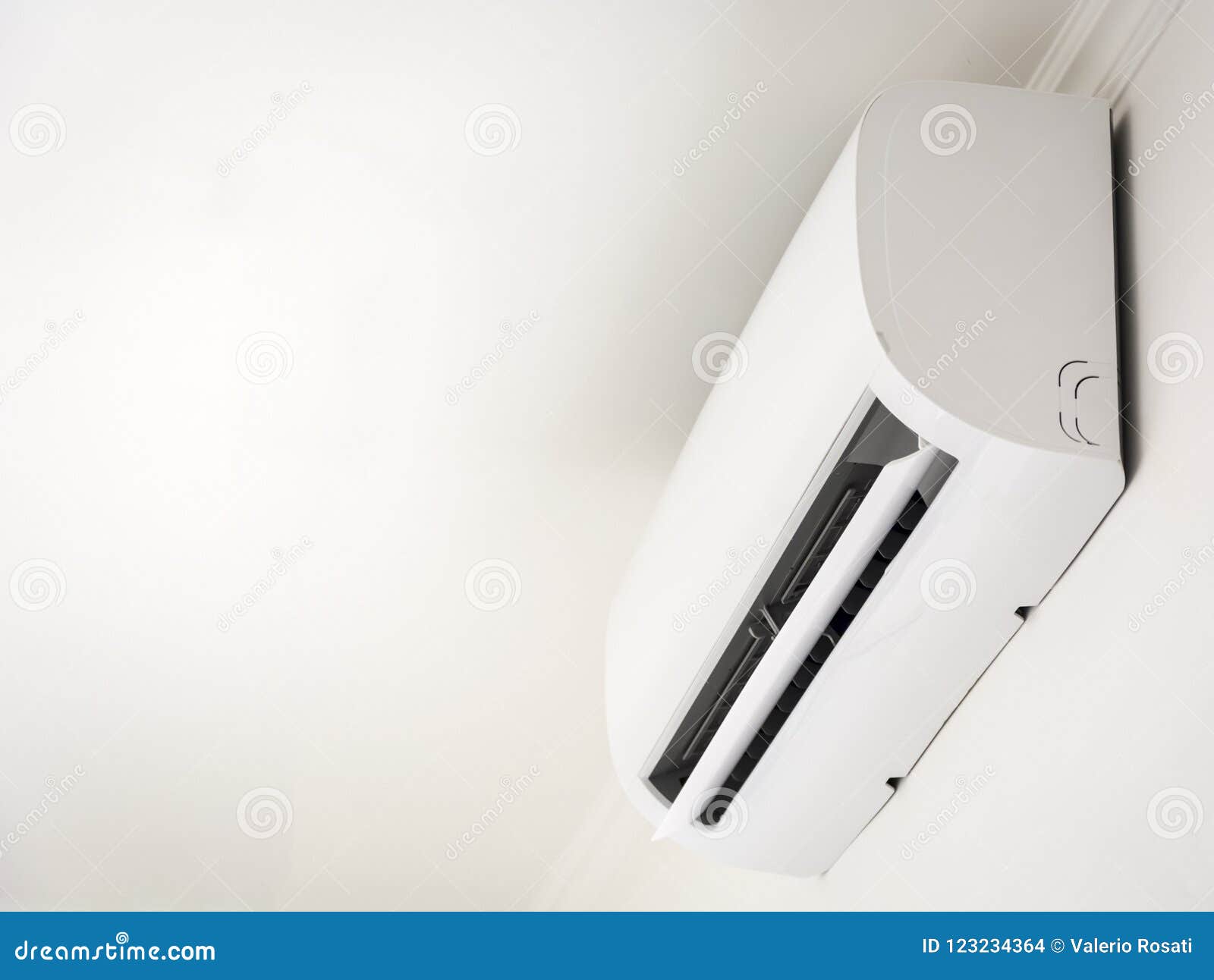 Close Up White Air Conditioner Swing Mounted on a White Wall Stock ...