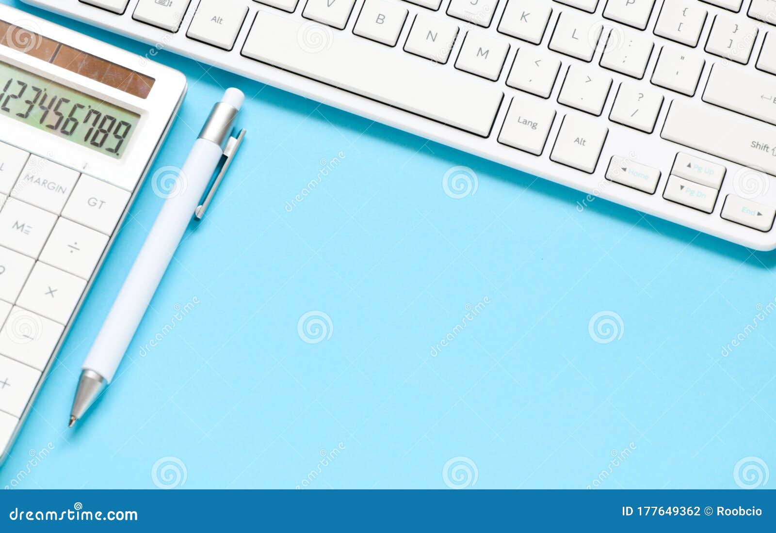 Close Up White Computer Keyboard and Calculator on Blue Background ...