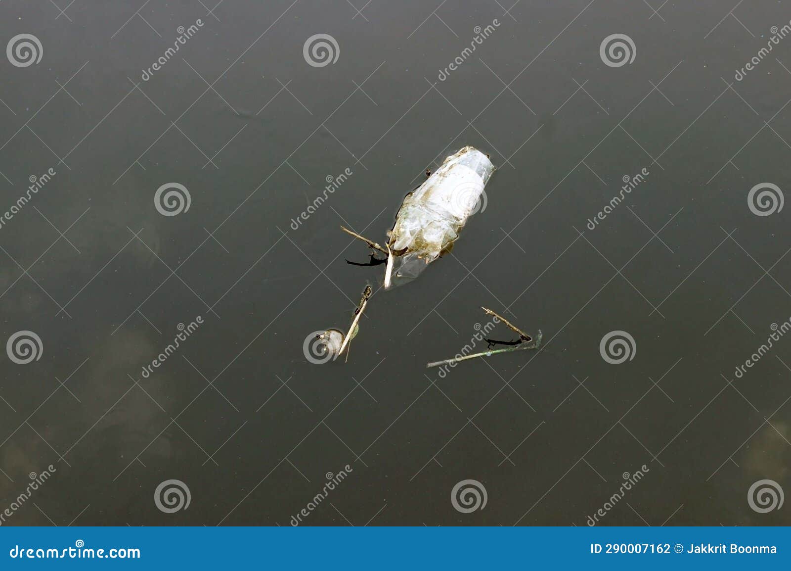 Close Up a White Plastic Waste Floating in the Water, Environment ...