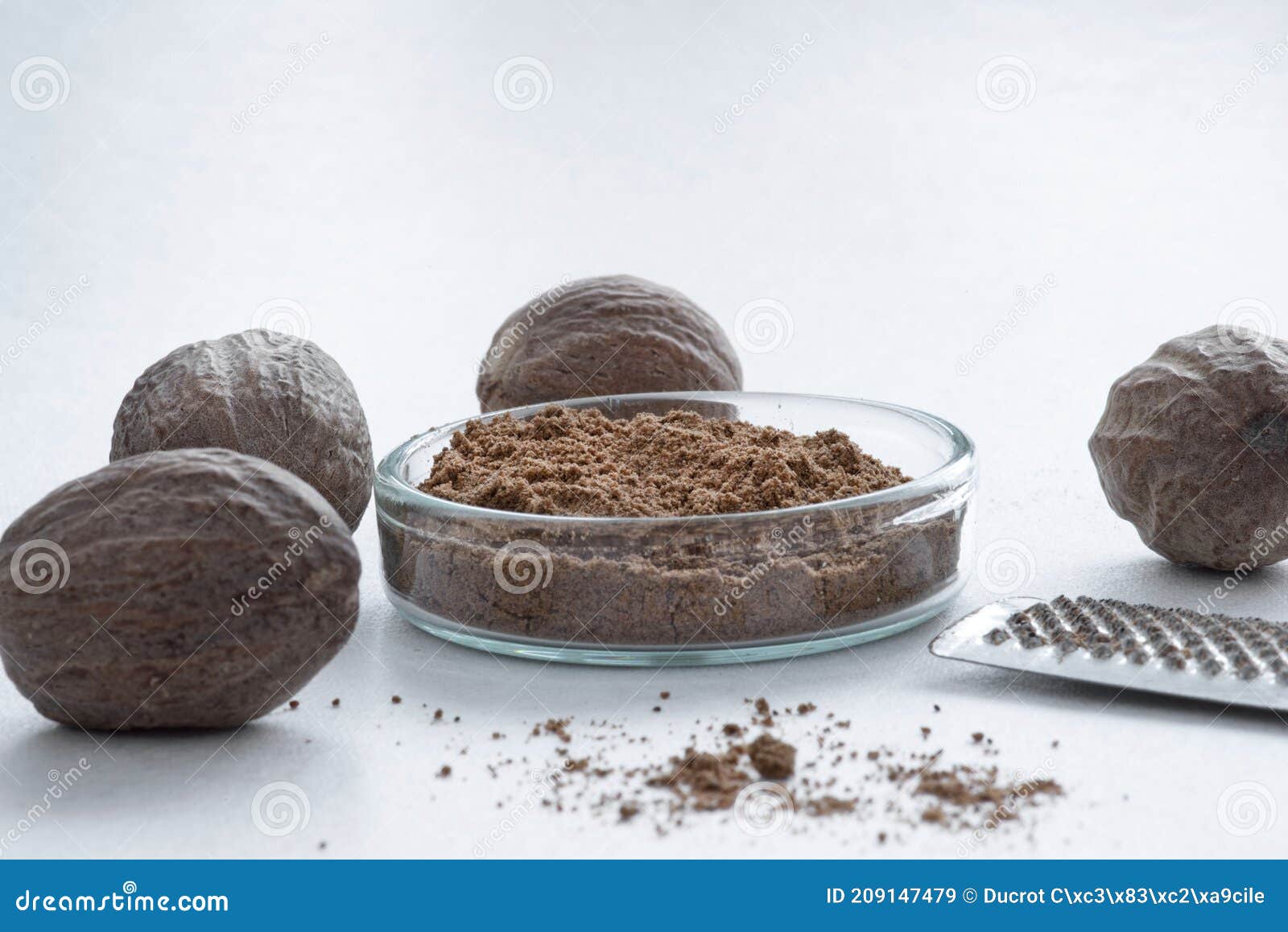 Whole and grated nutmeg stock image. Image of nutmeg - 209147479