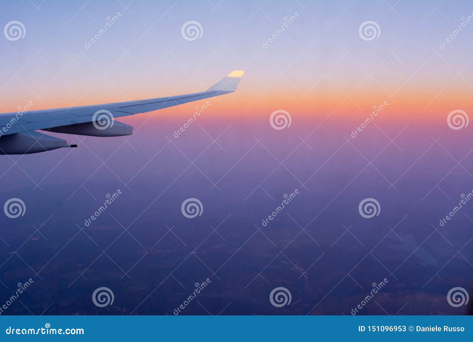 Close Up of Wing of an Airplane in Flight on Colored Clear Sky ...