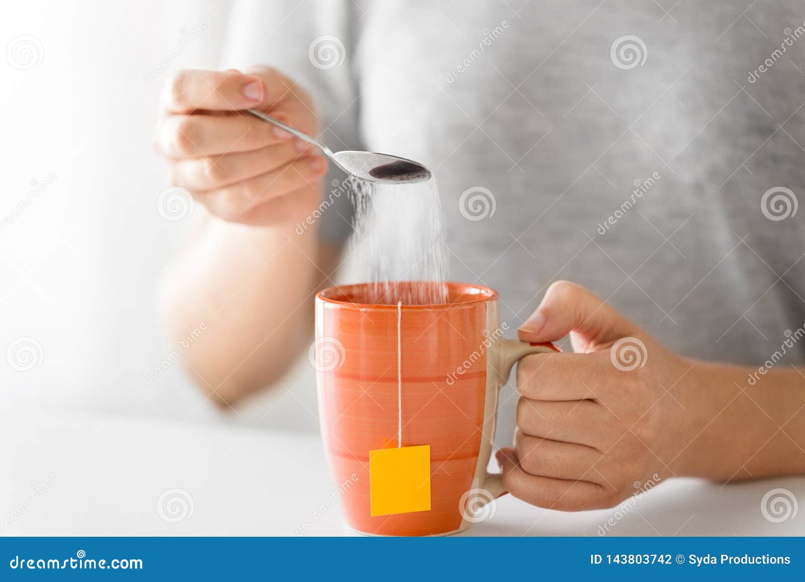 Close Up of Woman Adding Sugar To Cup of Tea Stock Photo - Image of ...