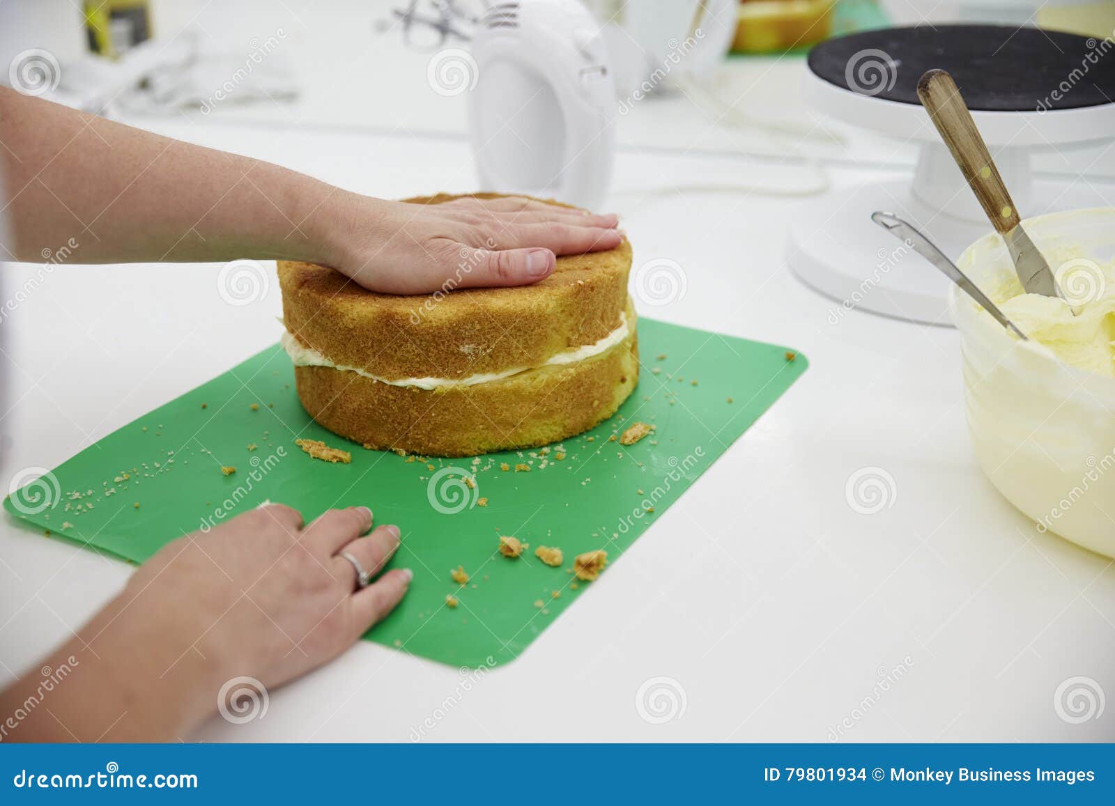 Close Up of Woman in Bakery Preparing Cake for Decoration Stock Photo ...