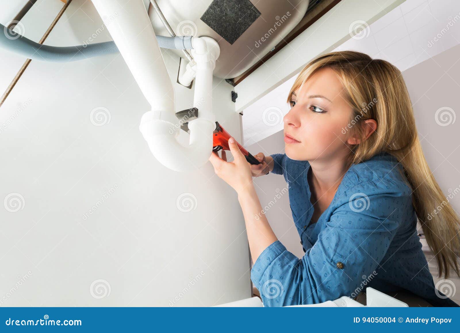 Close-up of Woman Fixing Sink Pipe with Wrench Stock Photo - Image of ...