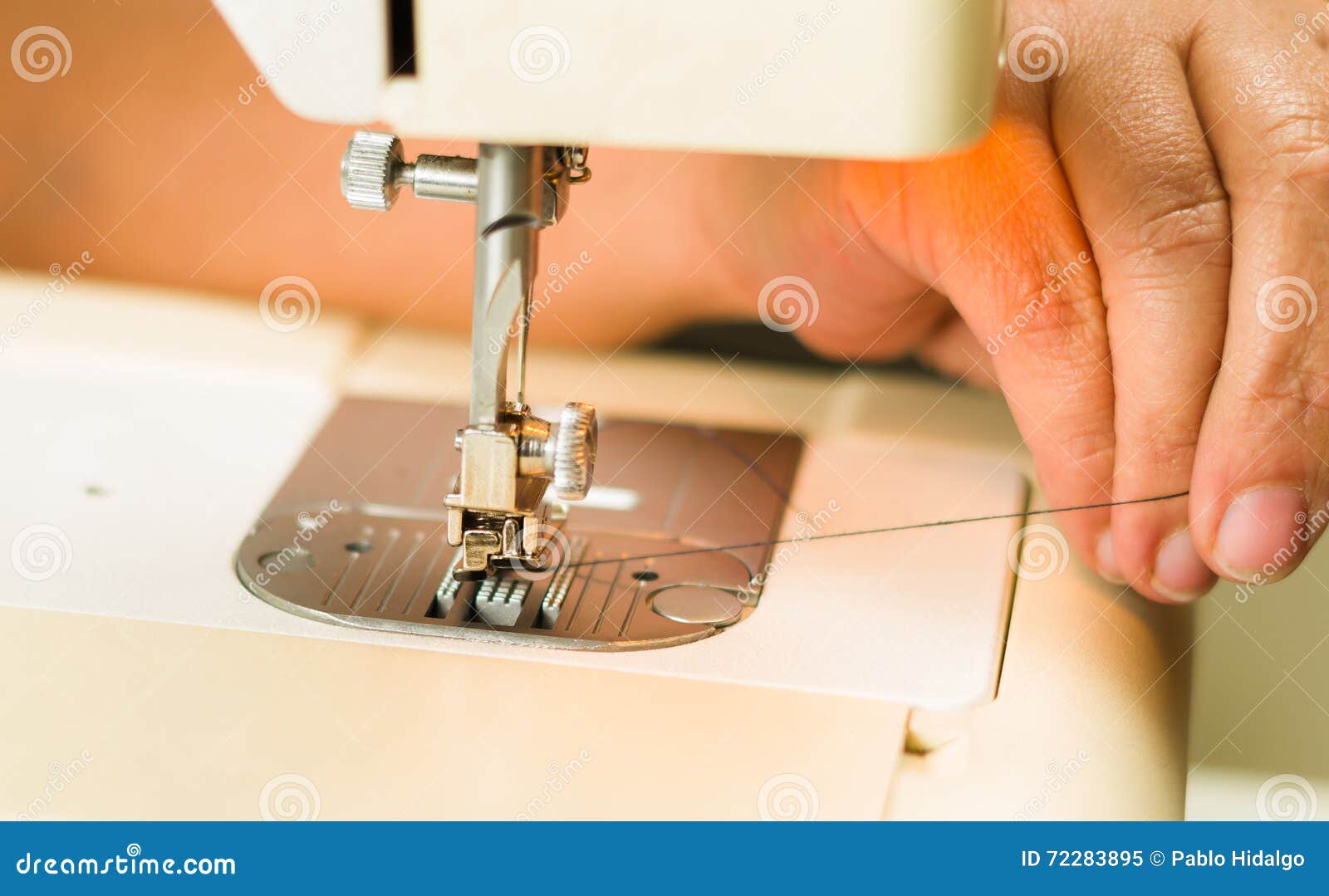 Close Up of Woman Hand Adjusting the Thread and the Needle on a Sewing ...