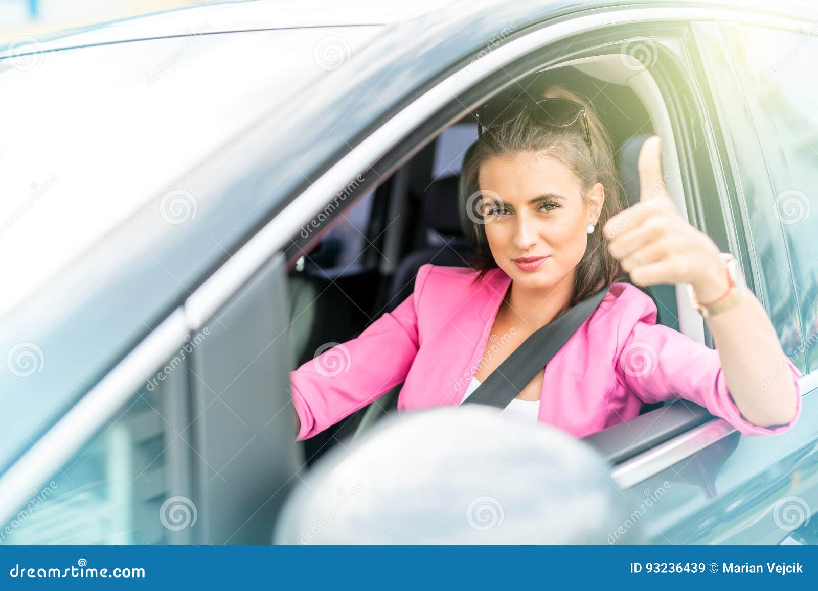 Close-up of a Woman Hand Showing a Thumbs-up Sign Out with Car Windows ... Close-up of a Woman Hand Showing a Thumbs-up Sign Out with Car Windows ...