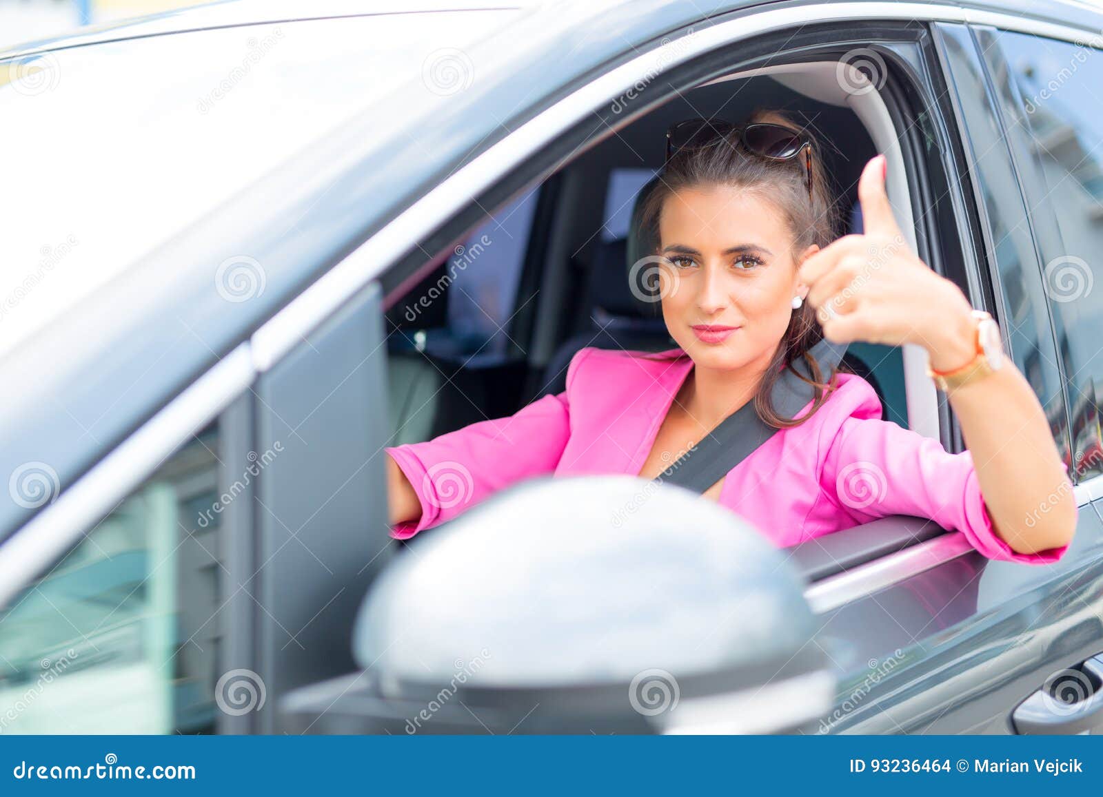 Close-up of a Woman Hand Showing a Thumbs-up Sign Out with Car Windows ... Close-up of a Woman Hand Showing a Thumbs-up Sign Out with Car Windows ...