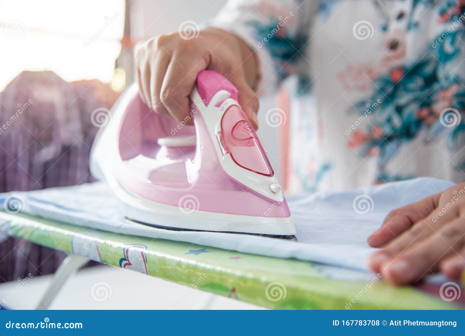Close Up of Woman Ironing Clothes on Ironing Board Stock Photo - Image ...