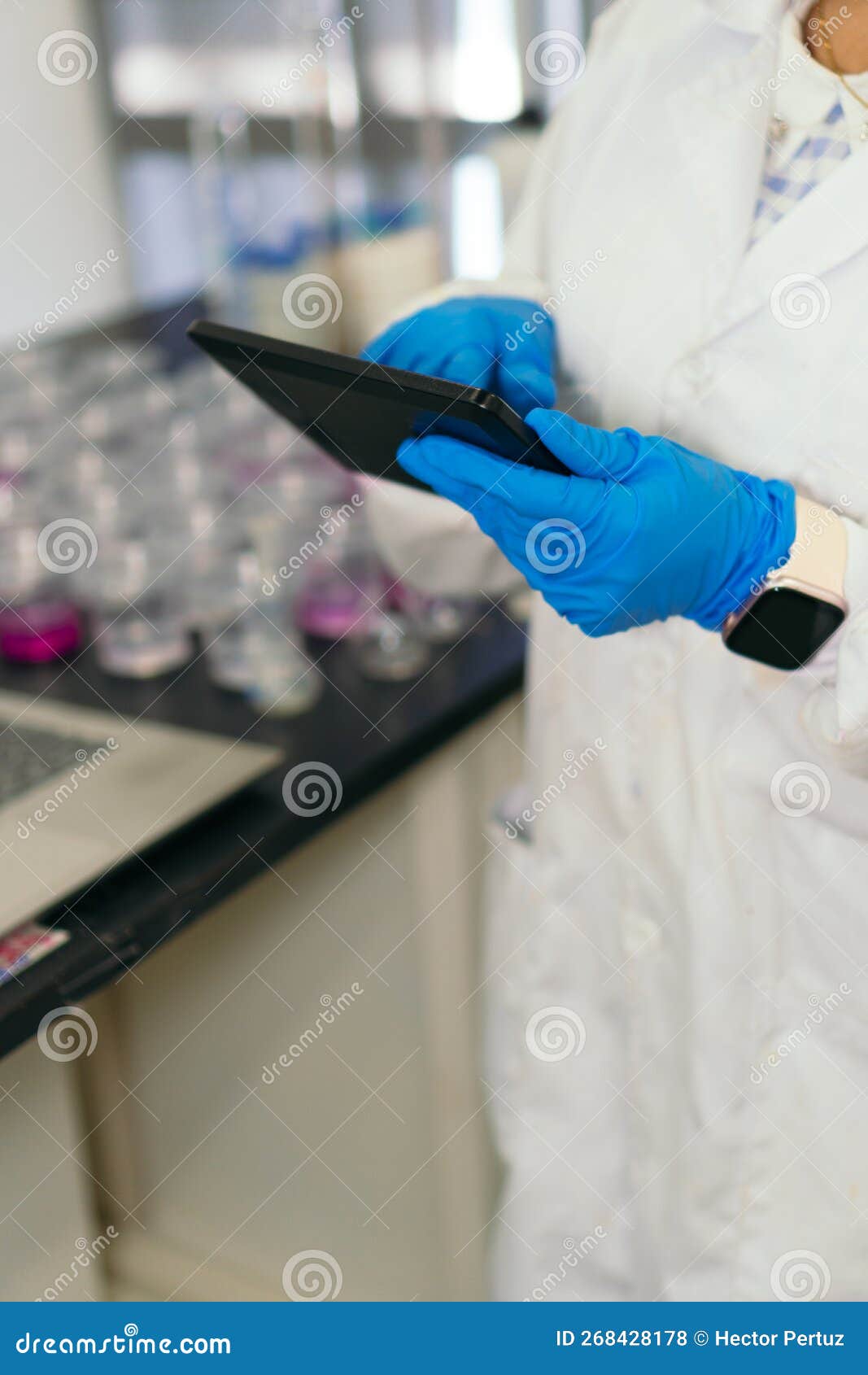 Close-up of Woman in Lab Coat Using Tablet in Lab Stock Photo - Image ...