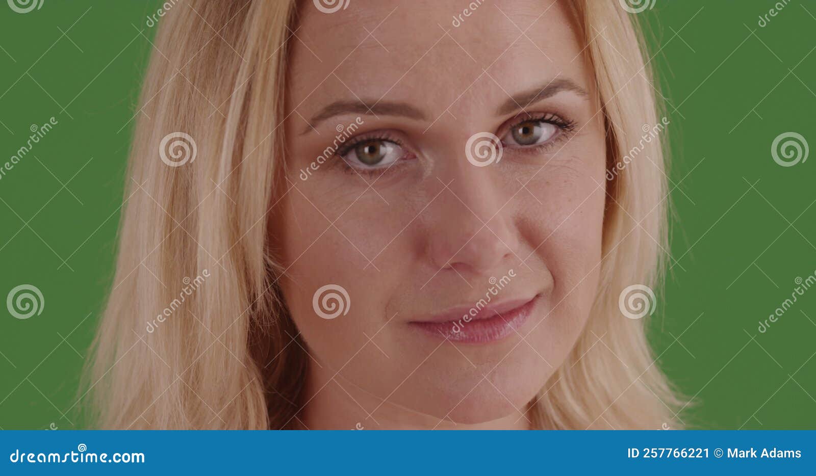 Close Up Of Woman Looking At Camera On Green Screen Stock Video