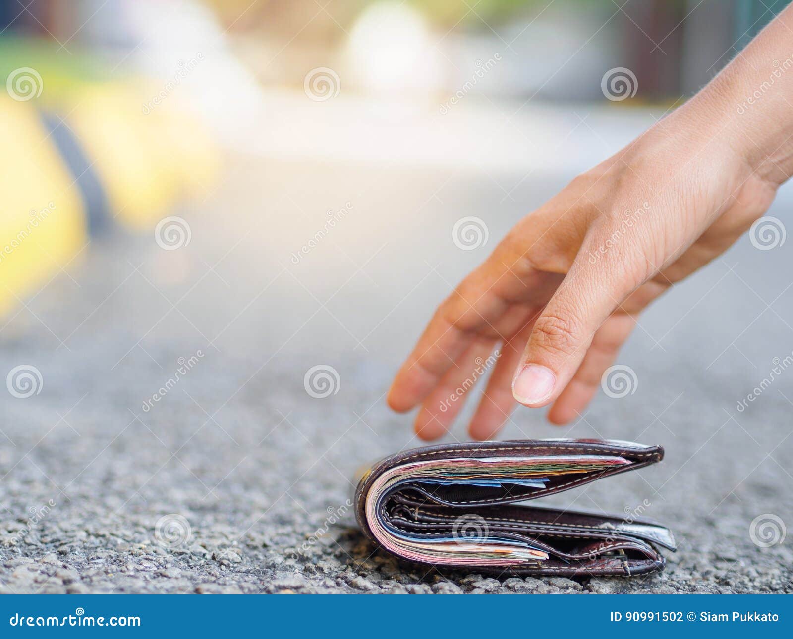 Close-up of a Woman Picking Up Fallen Wallet Stock Photo - Image of ...