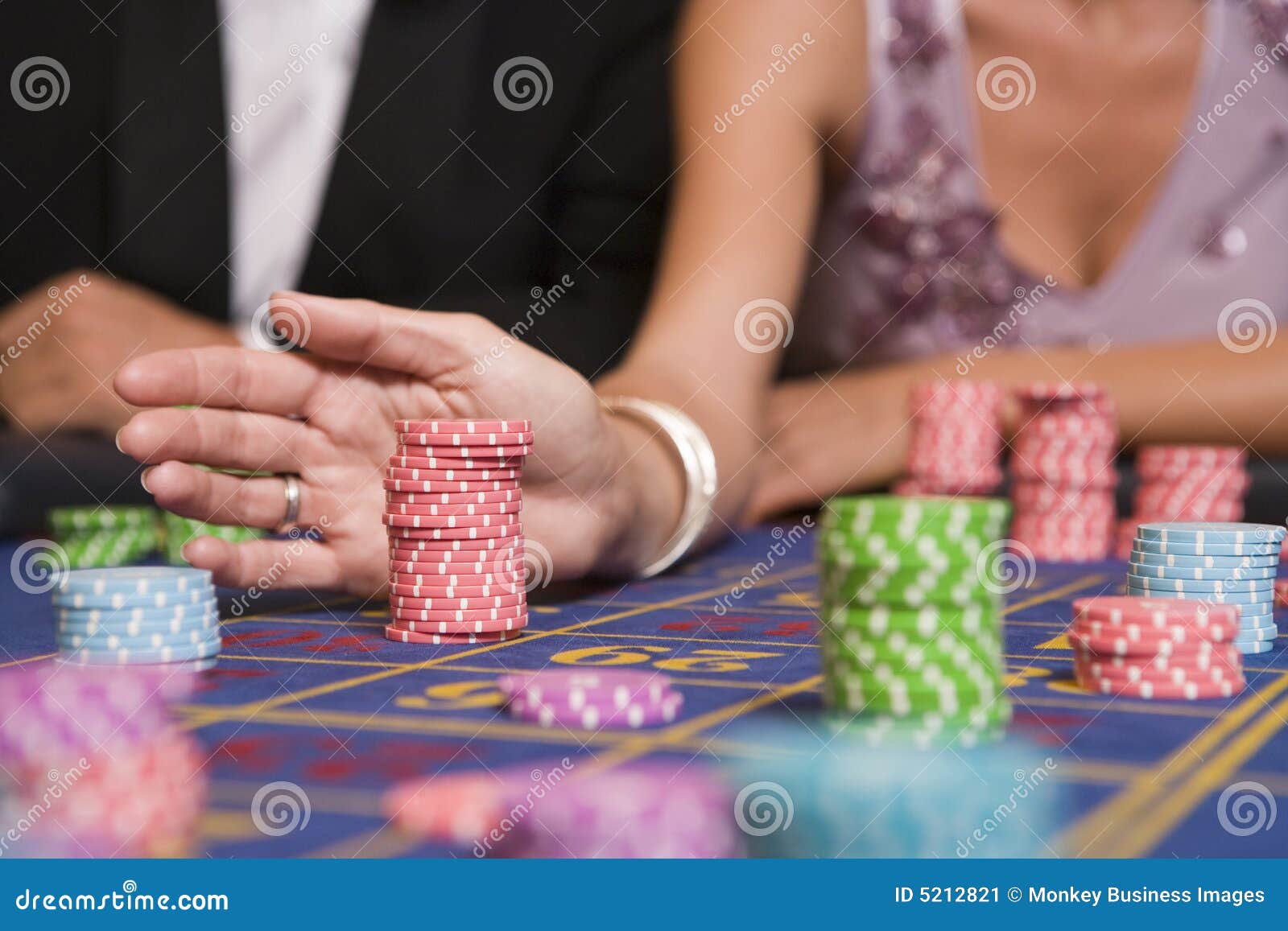 Close Up of Woman Placing Bet on Roulette Table Stock Image - Image of ...