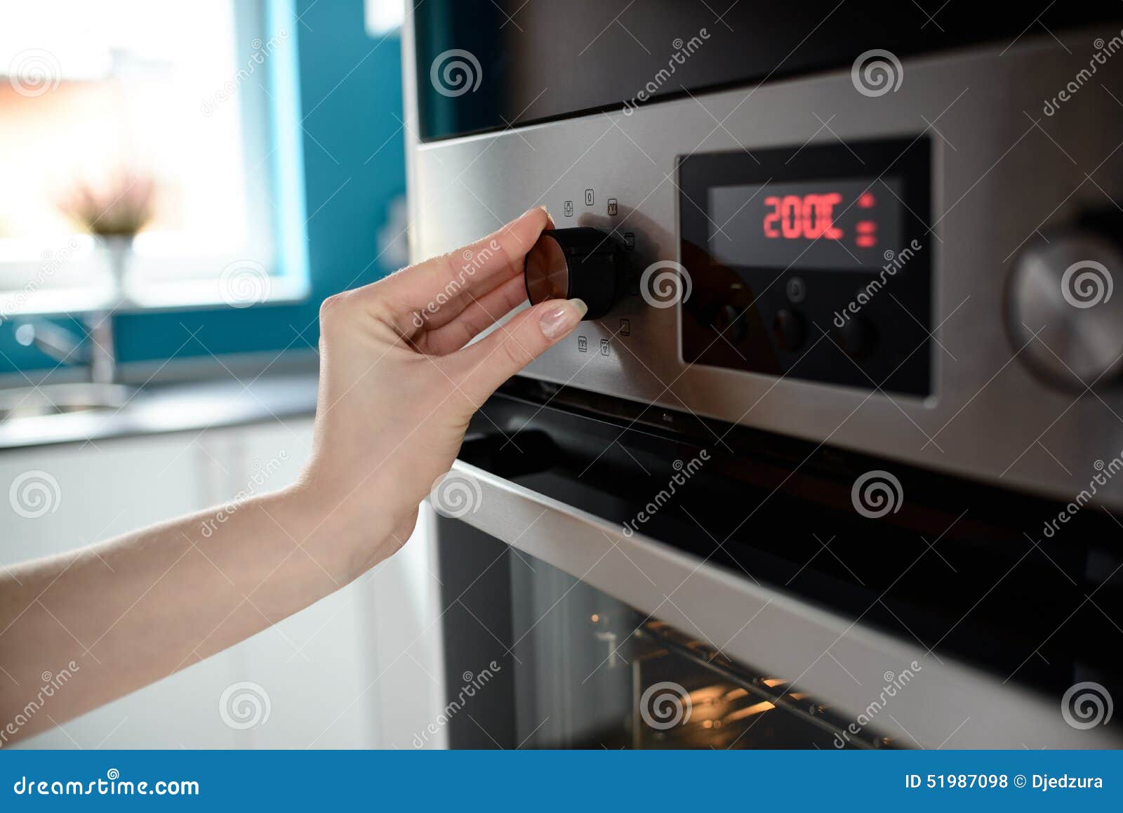 Close Up of Woman S Hand Setting Temperature Control on Oven Stock ... Close Up of Woman S Hand Setting Temperature Control on Oven Stock ...
