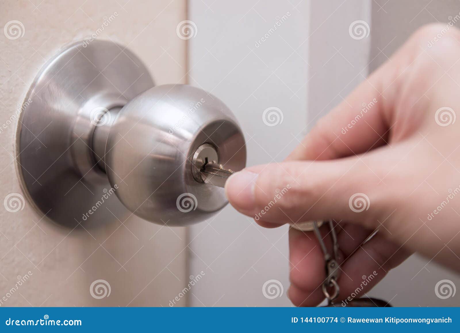 Close Up of Woman`s Hand Using Key for Unlocking or Locking the White ...