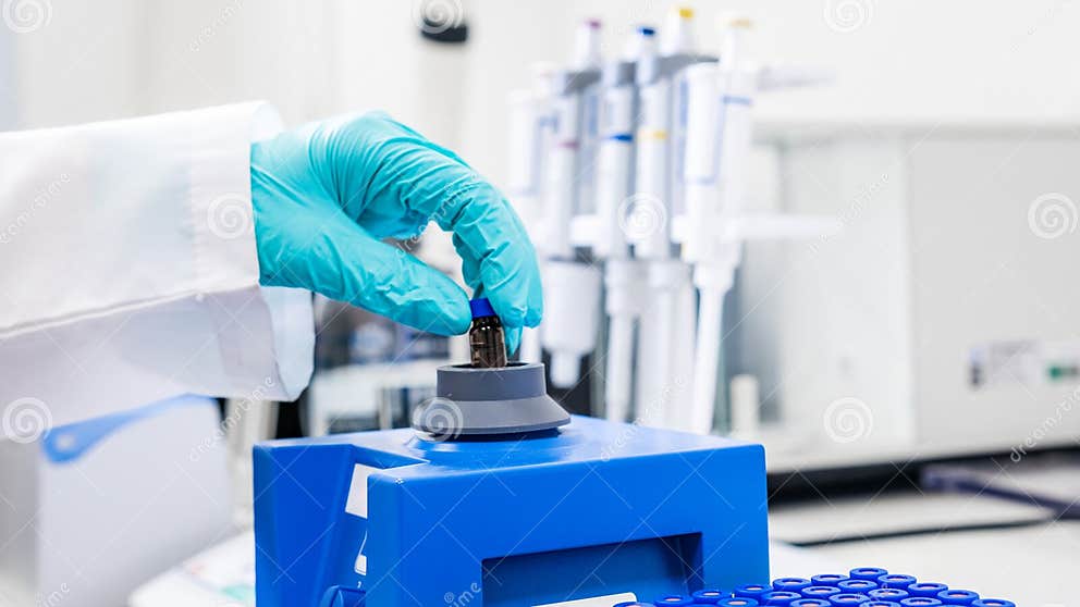 Close Up of a Woman Shaking Samples Using a Vortex Mixer before HPLC ...