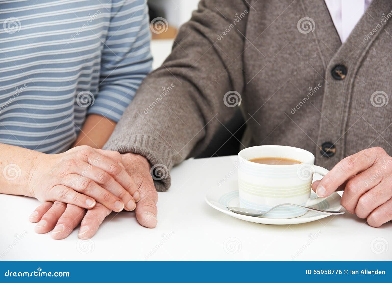 Close Up of Woman Sharing Cup of Tea with Elderly Parent Stock Photo ...